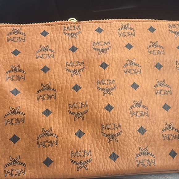 MCM | Bags | Mcm Cognac Logo Pattern Clutch | Poshmark